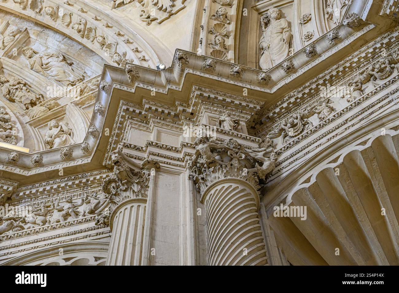 Ancient architectural capital atop a column, supporting arches adorned ...