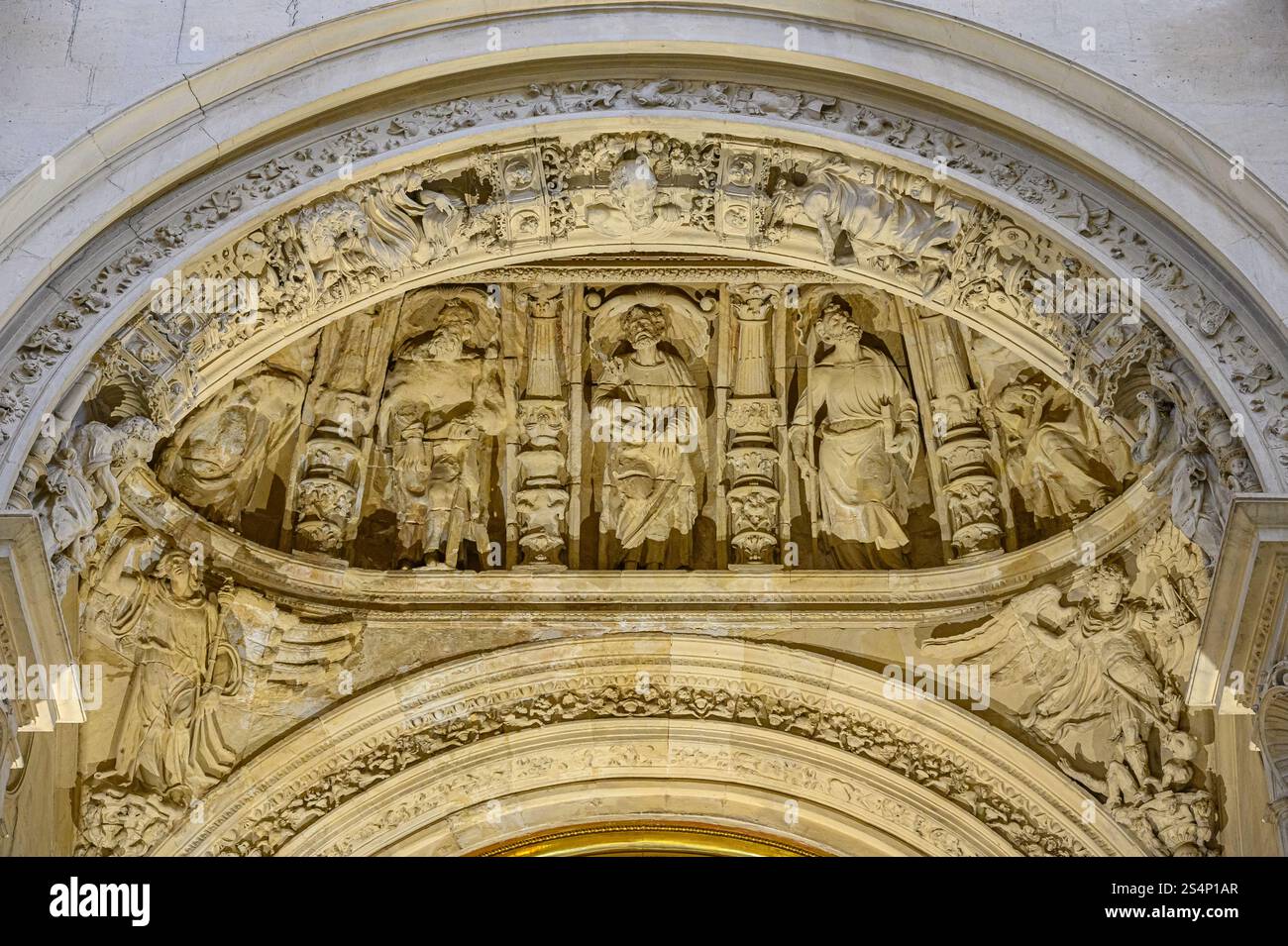 Stone sculptures adorning an old arch inside an ancient Catholic church ...