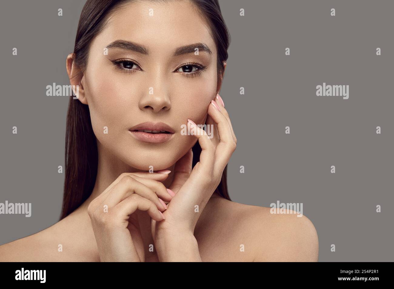 Young woman touching clean ideal skin of her face Stock Photo - Alamy