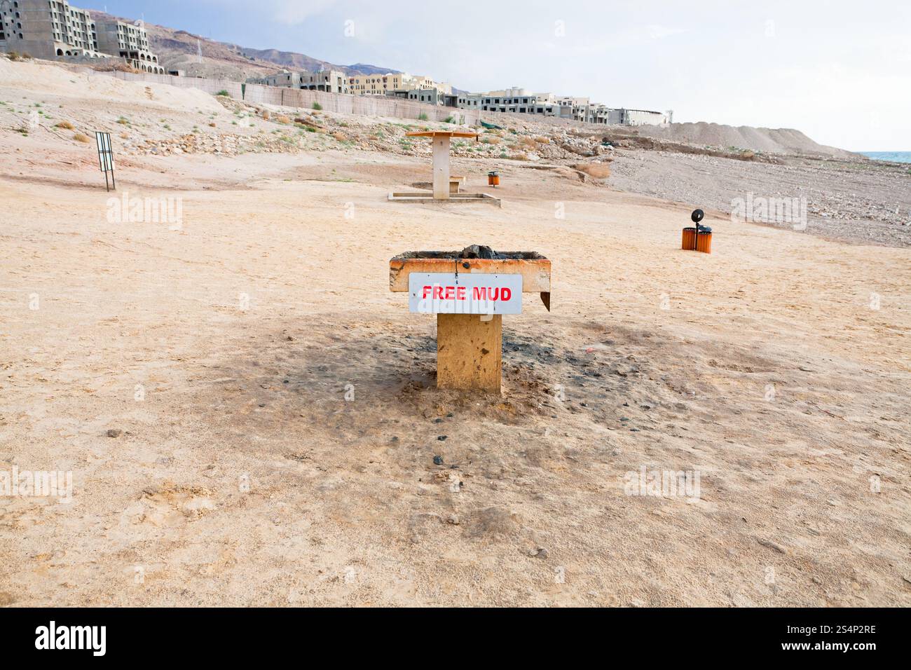 stand with free mineral mud on coast of Dead Sea Stock Photo - Alamy