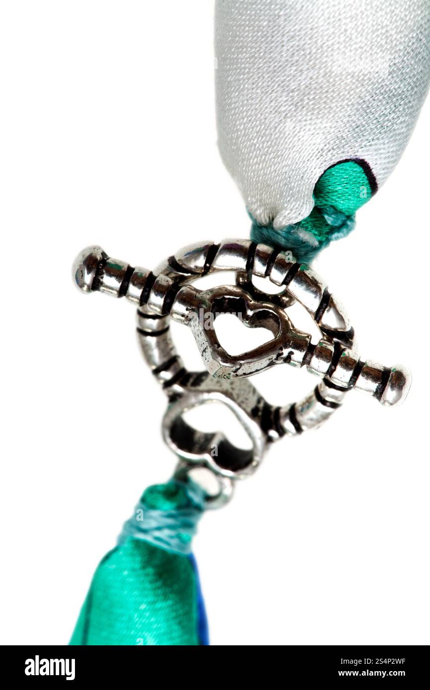 heart shape buckle of silk bead close up isolated on white Stock Photo ...