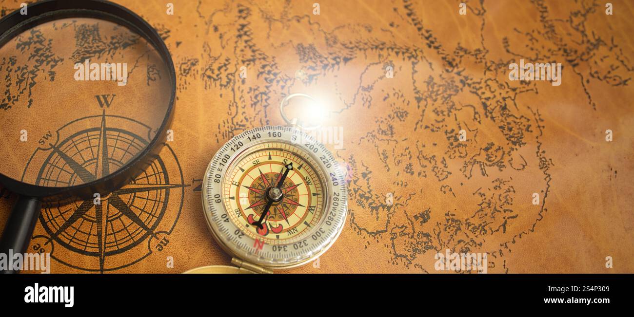Compass and old map. Close up of compass on old paper map background ...