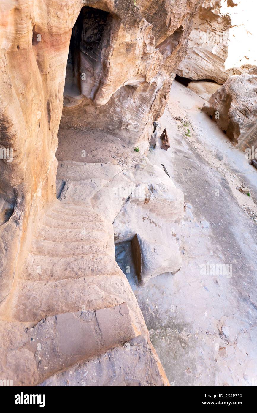 steep ancient stone steps to antique living chamber in Little Petra ...