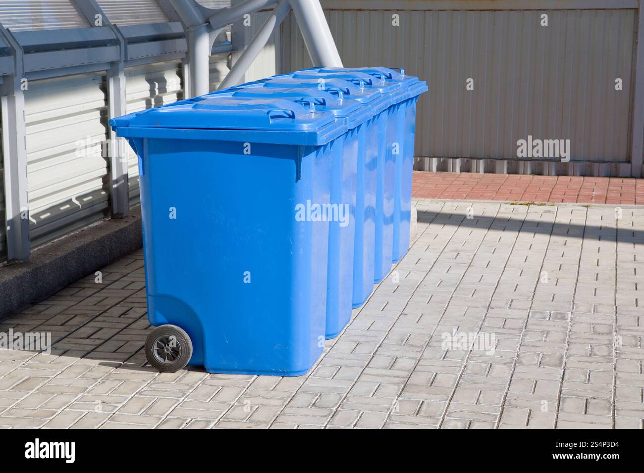 blue plastic recycling bins outdoor Stock Photo - Alamy