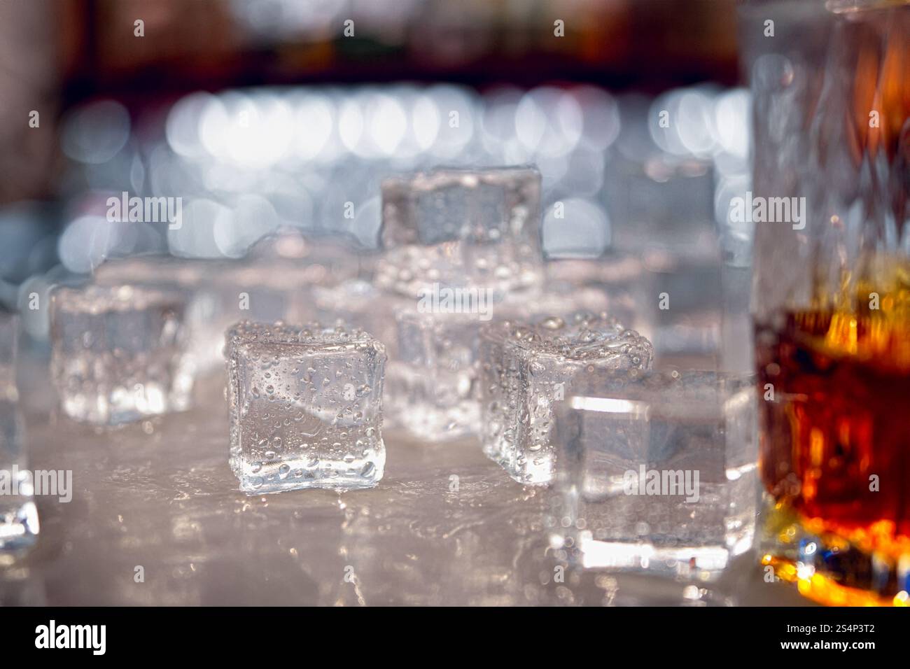 Ice cubes, Close-up. Water drops and splashes. Cool drink, alcohol ...