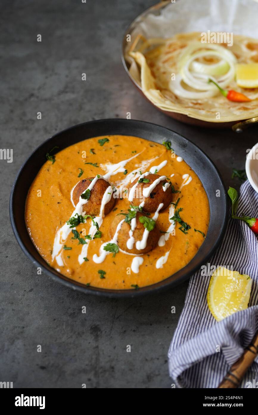 Malai Kofta served with Paratha |Indian vegetarian creamy curry with ...