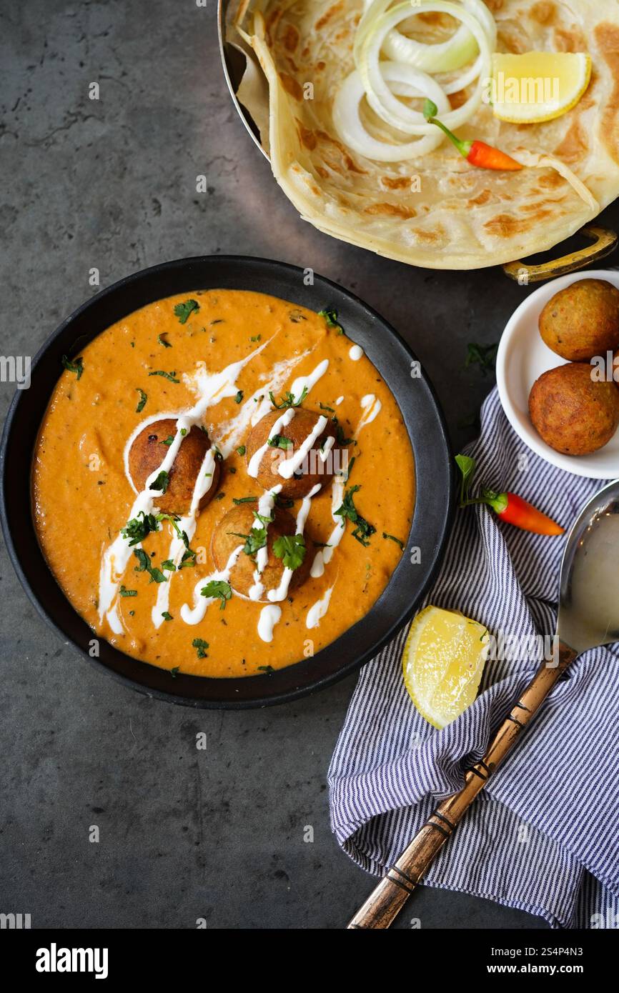 Malai Kofta served with Paratha |Indian vegetarian creamy curry with ...