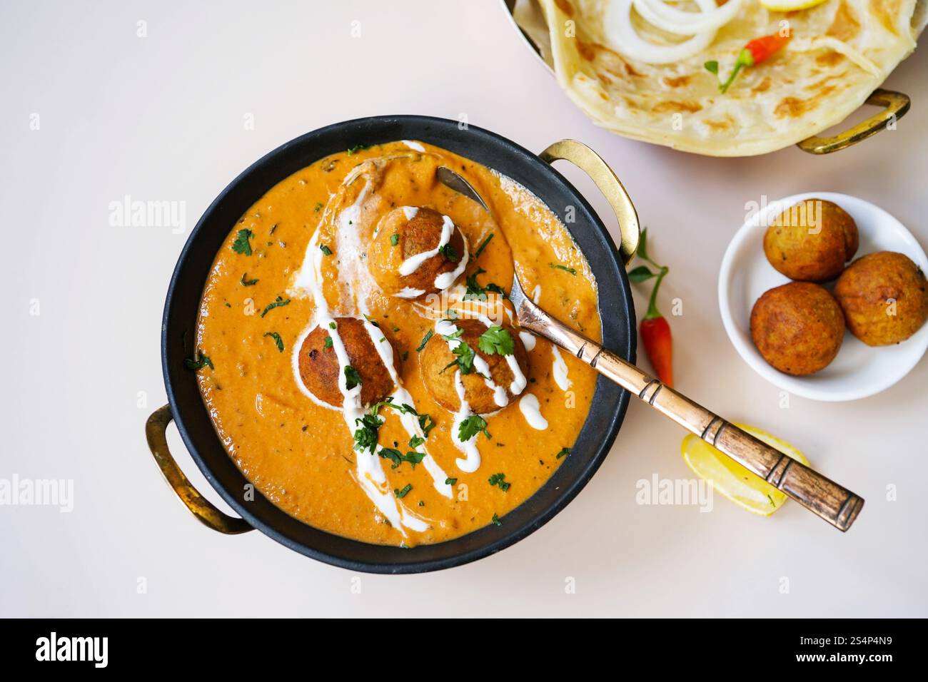 Malai Kofta served with Paratha |Indian vegetarian creamy curry with ...