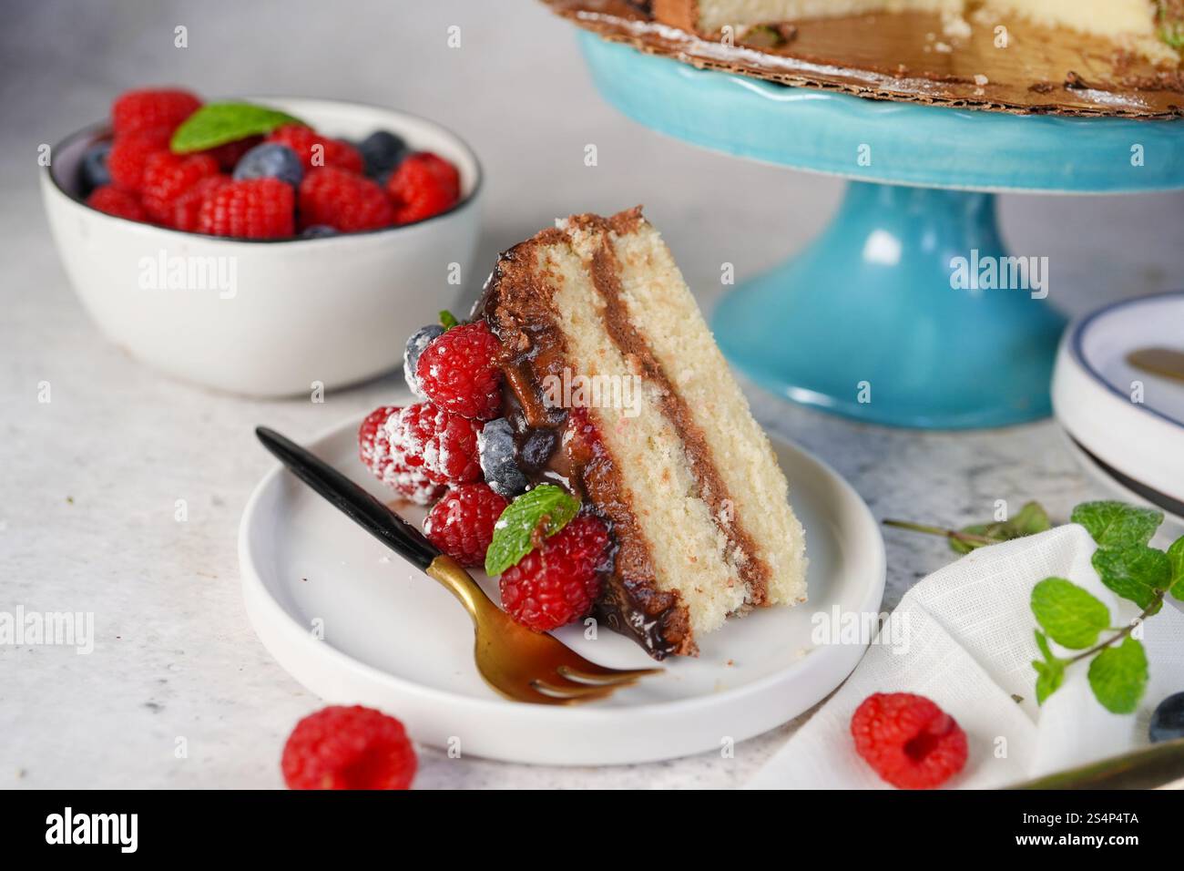 Homemade vanilla layered sponge cake with chocolate buttercream ...