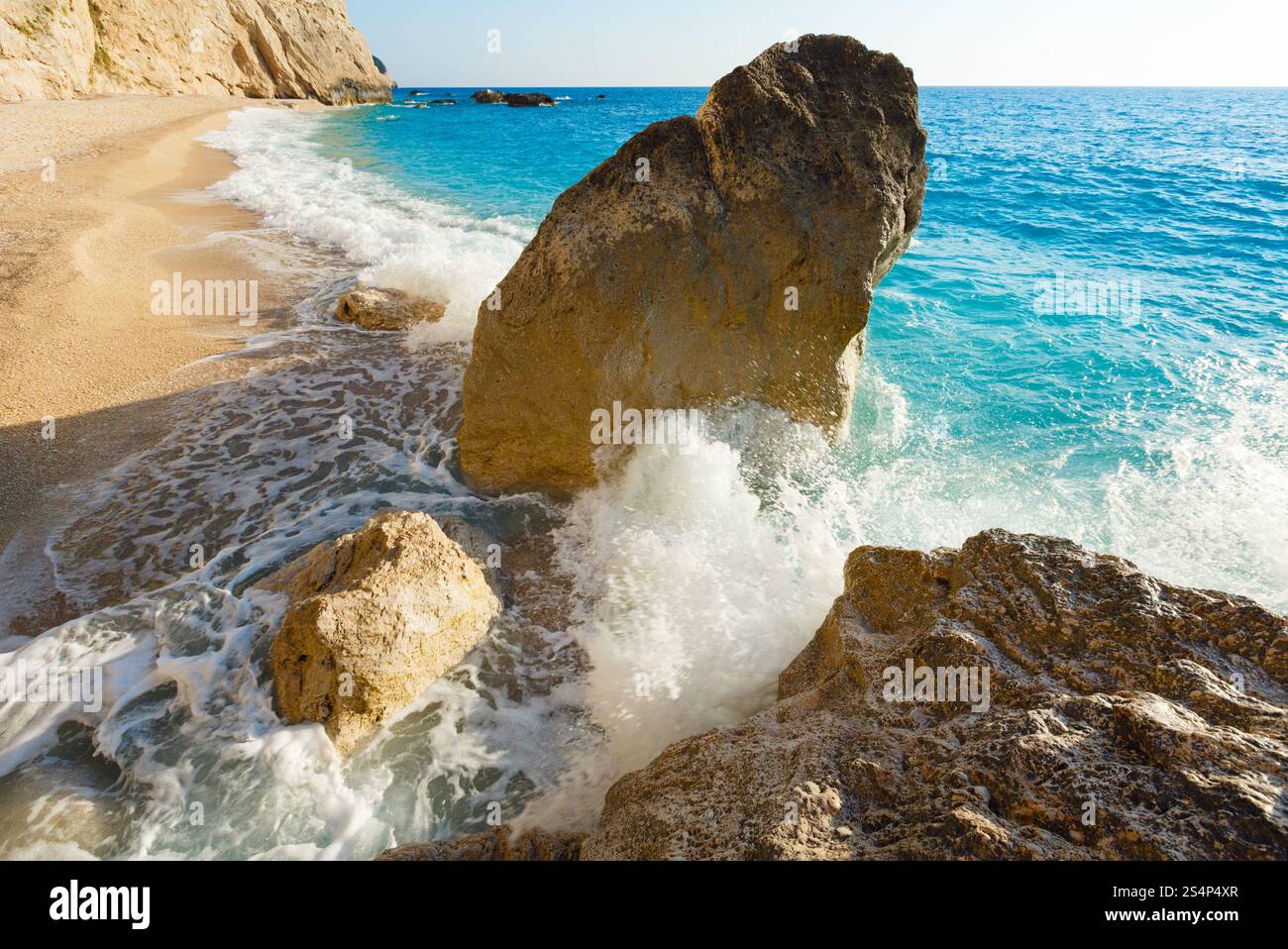 Big rocks fragment on white beach and azure wave on Ionian Sea (Lefkada ...