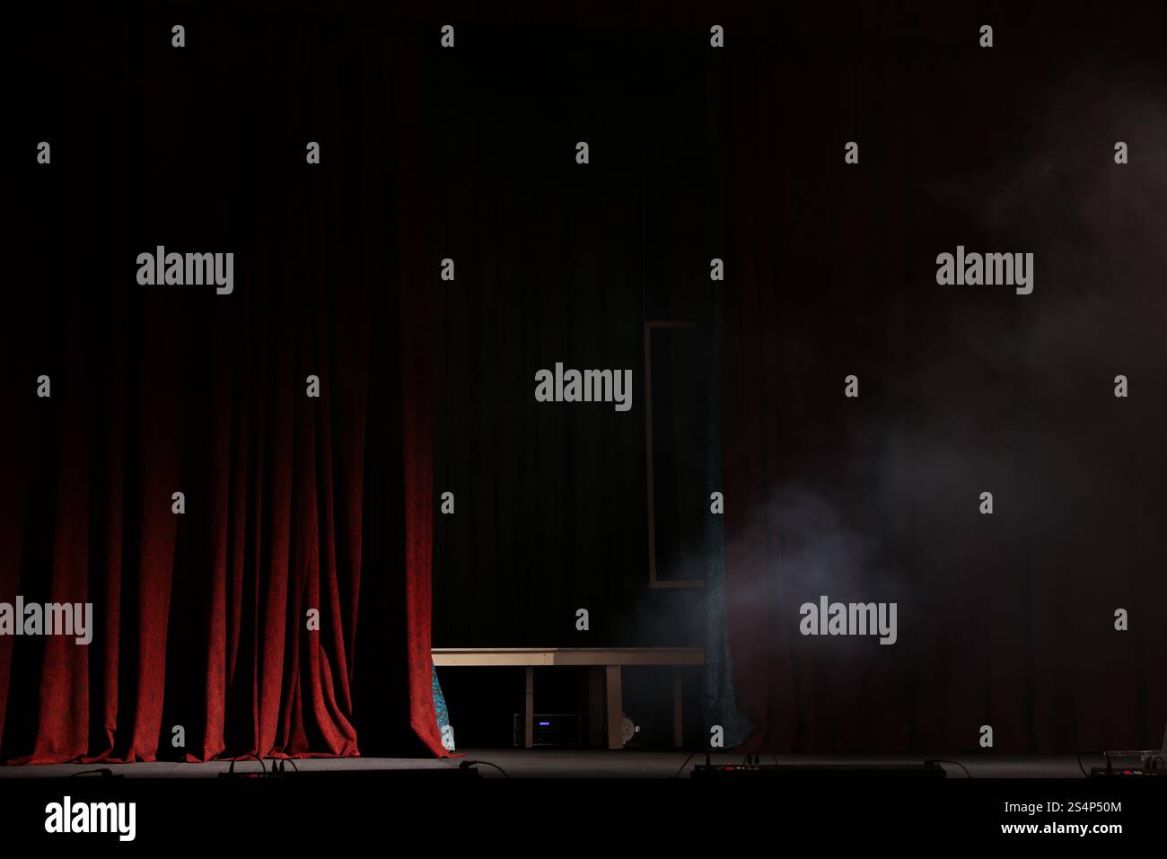 Smoke on dark stage in modern theatre Stock Photo - Alamy