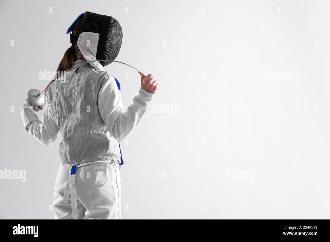 Fencer with epee on white background, space for text Stock Photo - Alamy