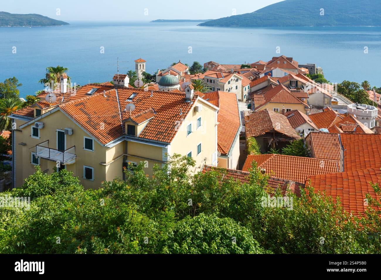 Summer view on houses with red roof and Bay of Kotor from Forte Mare ...