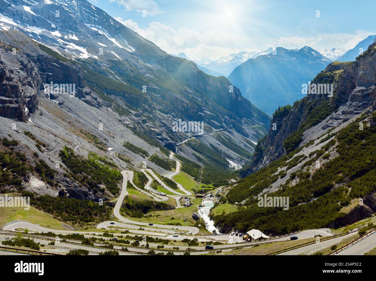 Summer Stelvio pass with alpine road and snow on slope (Italy) and ...