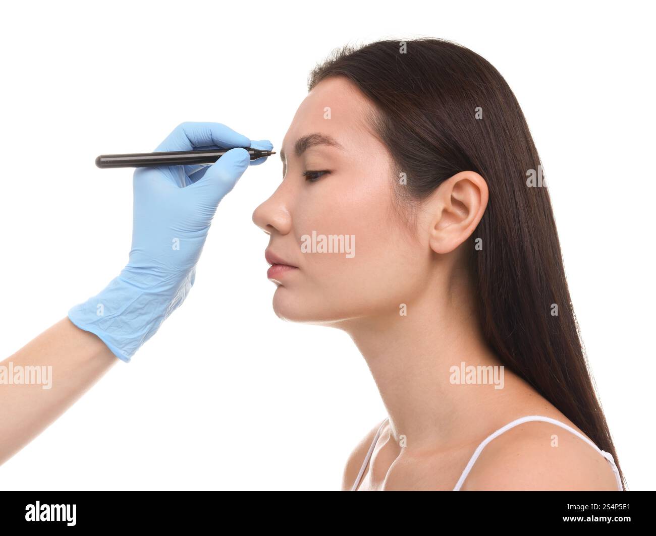 Doctor drawing marks on patient's nose for plastic surgery operation ...