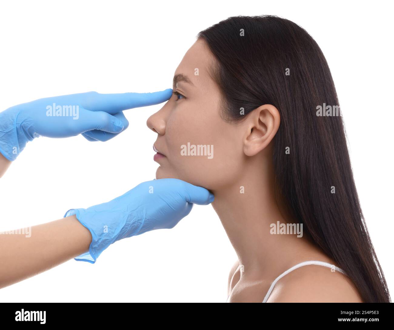 Doctor checking patient's nose before plastic surgery operation on ...