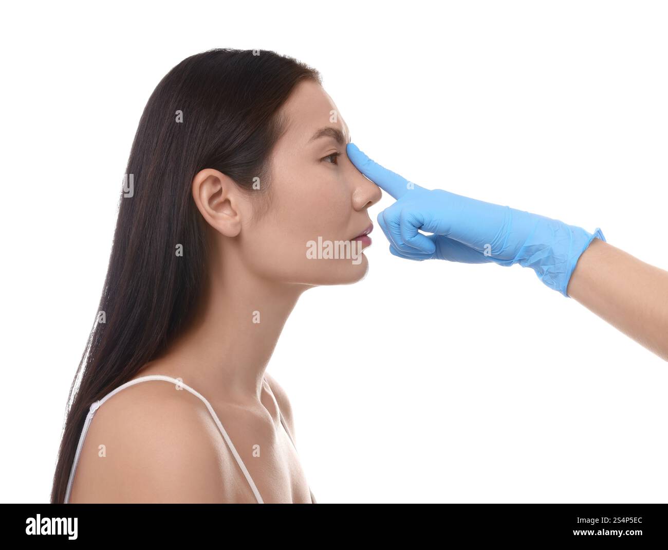Doctor checking patient's nose before plastic surgery operation on ...