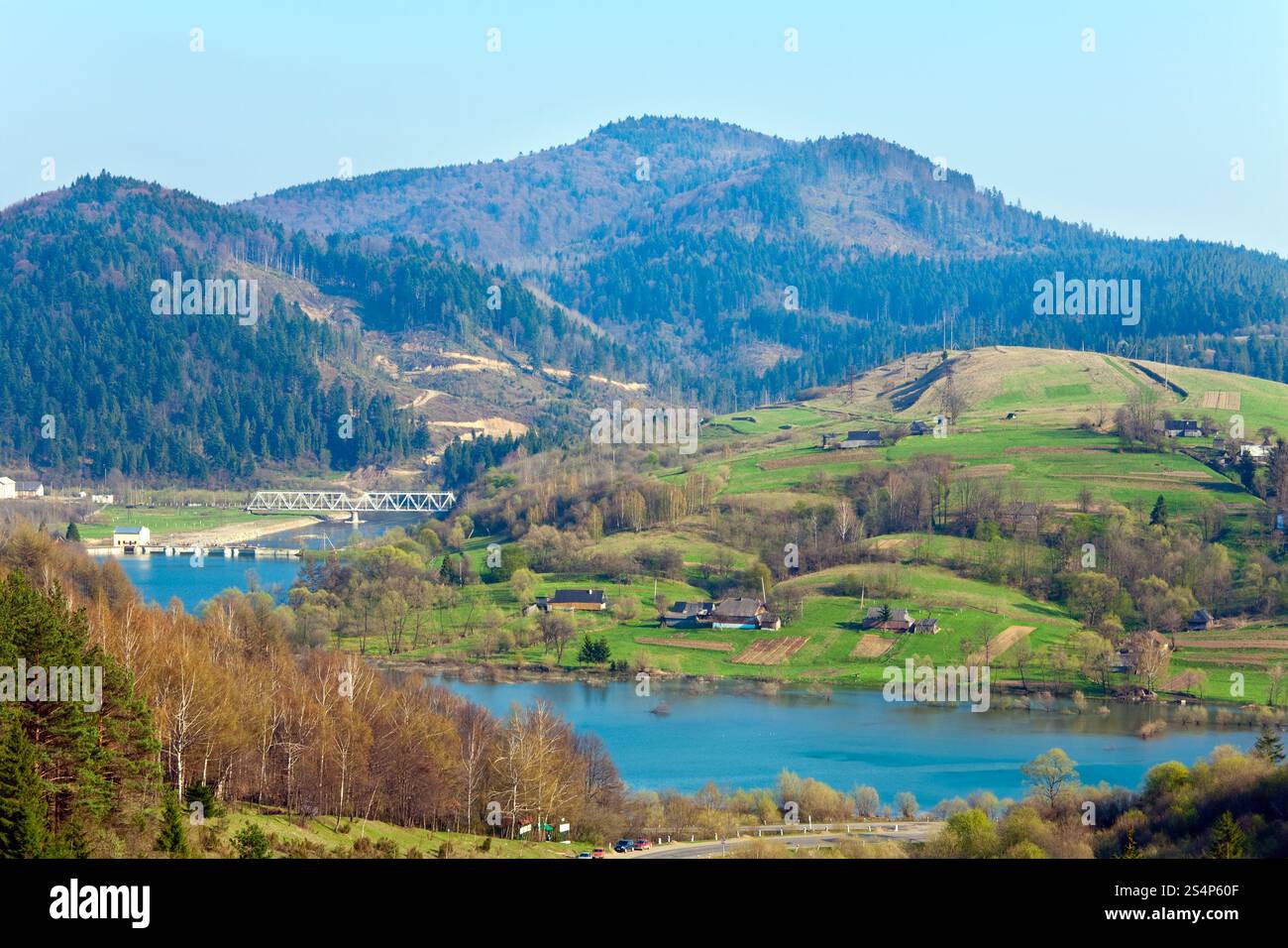 Spring country landscape with village and river Stock Photo - Alamy