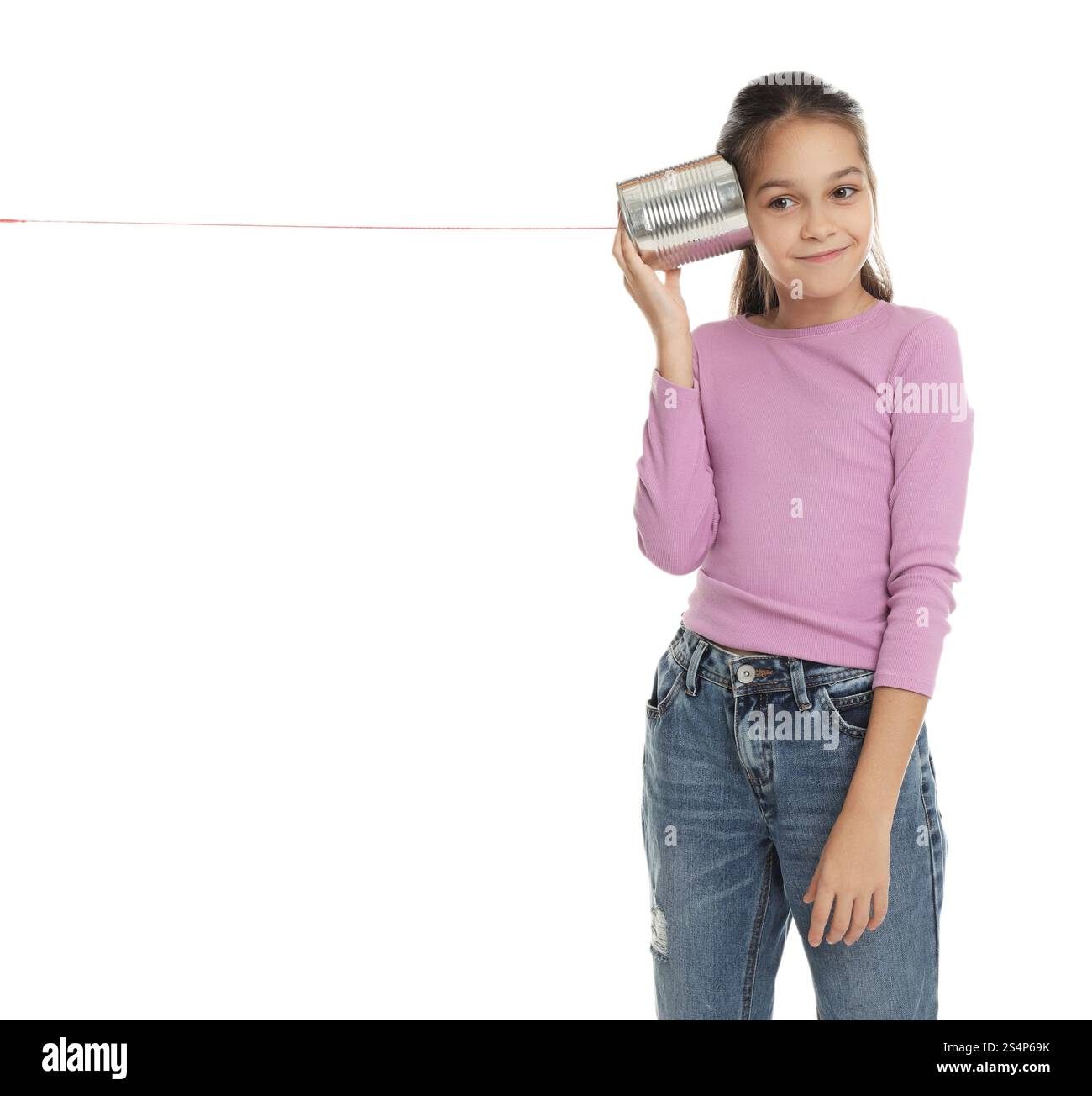 Girl using tin can telephone on white background Stock Photo - Alamy