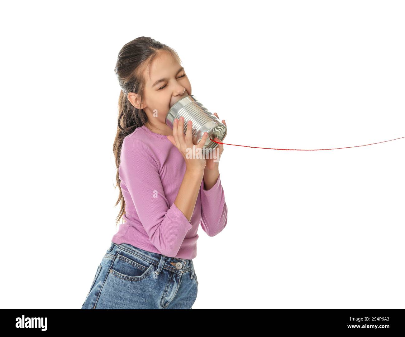 Girl using tin can telephone on white background Stock Photo - Alamy