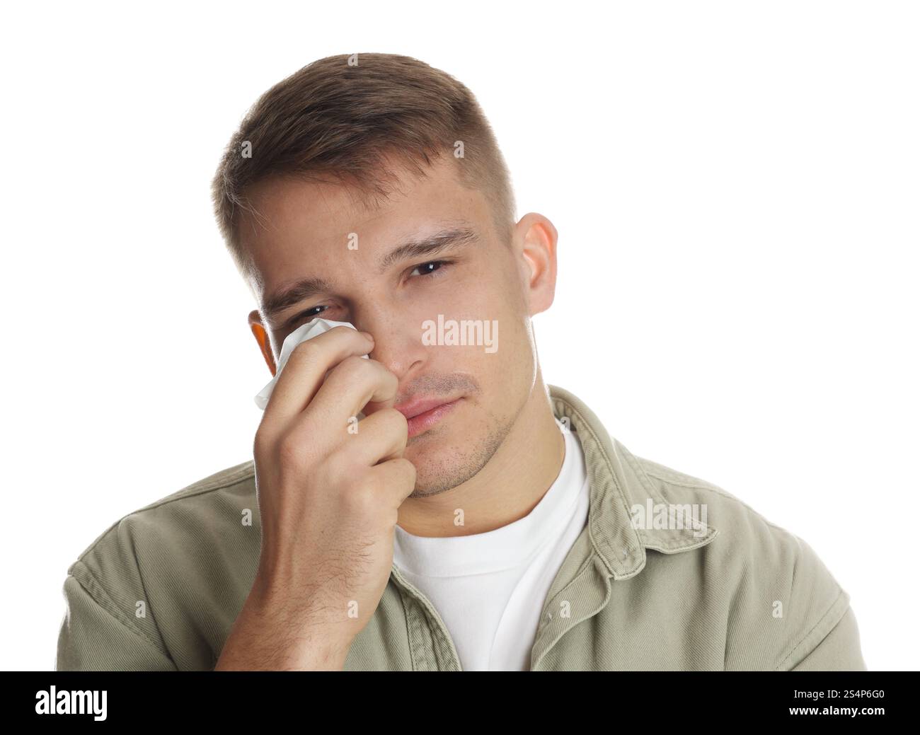 Crying man wiping tears with tissue on white background Stock Photo - Alamy
