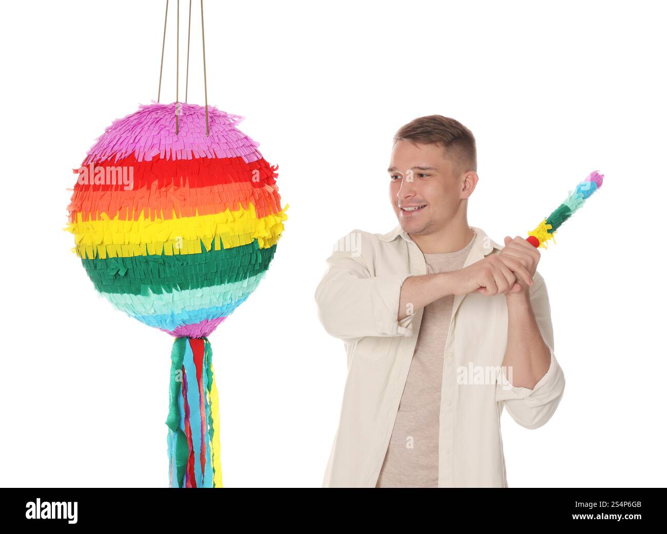 Happy man breaking pinata on white background Stock Photo - Alamy