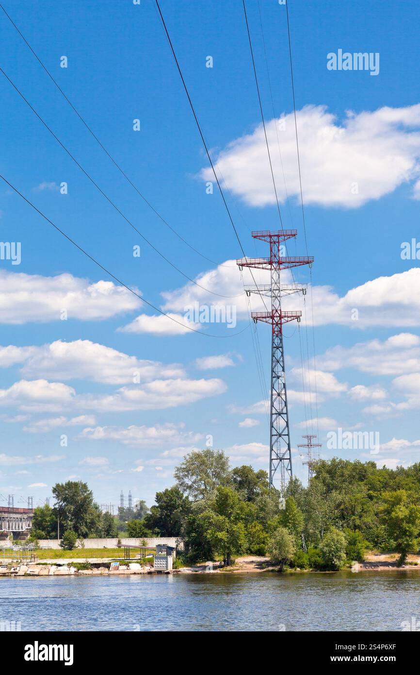 Electric power transmission through river Stock Photo - Alamy