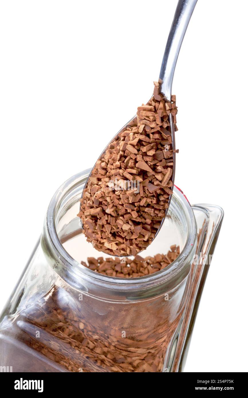 spoon in glass pot with instant coffee isolated on white background ...