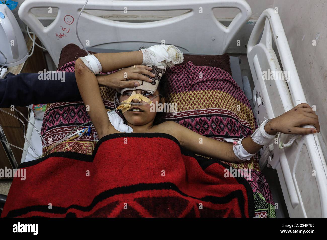 Palestinian girl Saba Abu Abeda, 13, receives medical care at Al-Aqsa ...