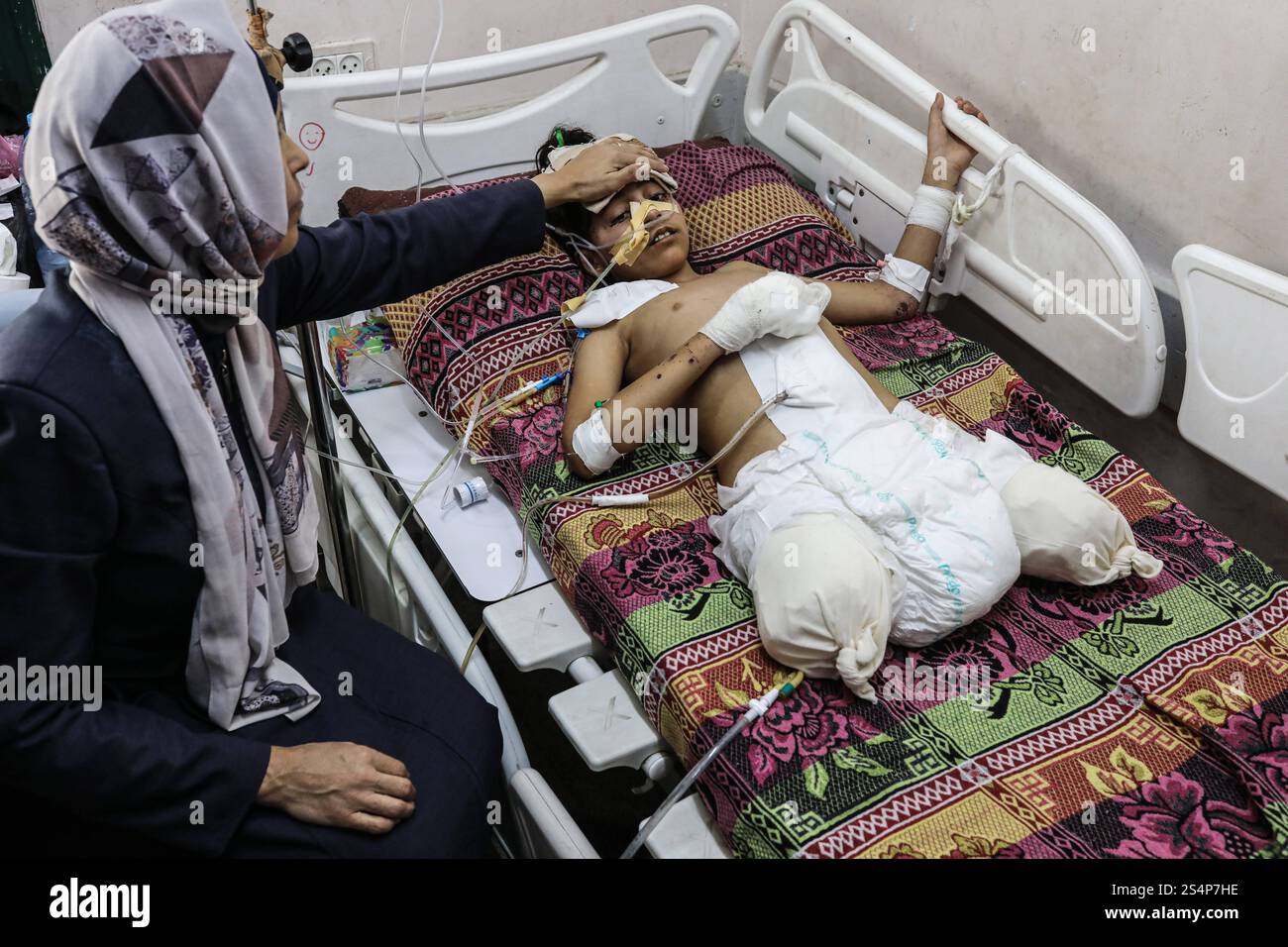 Palestinian girl Saba Abu Abeda, 13, receives medical care at Al-Aqsa ...