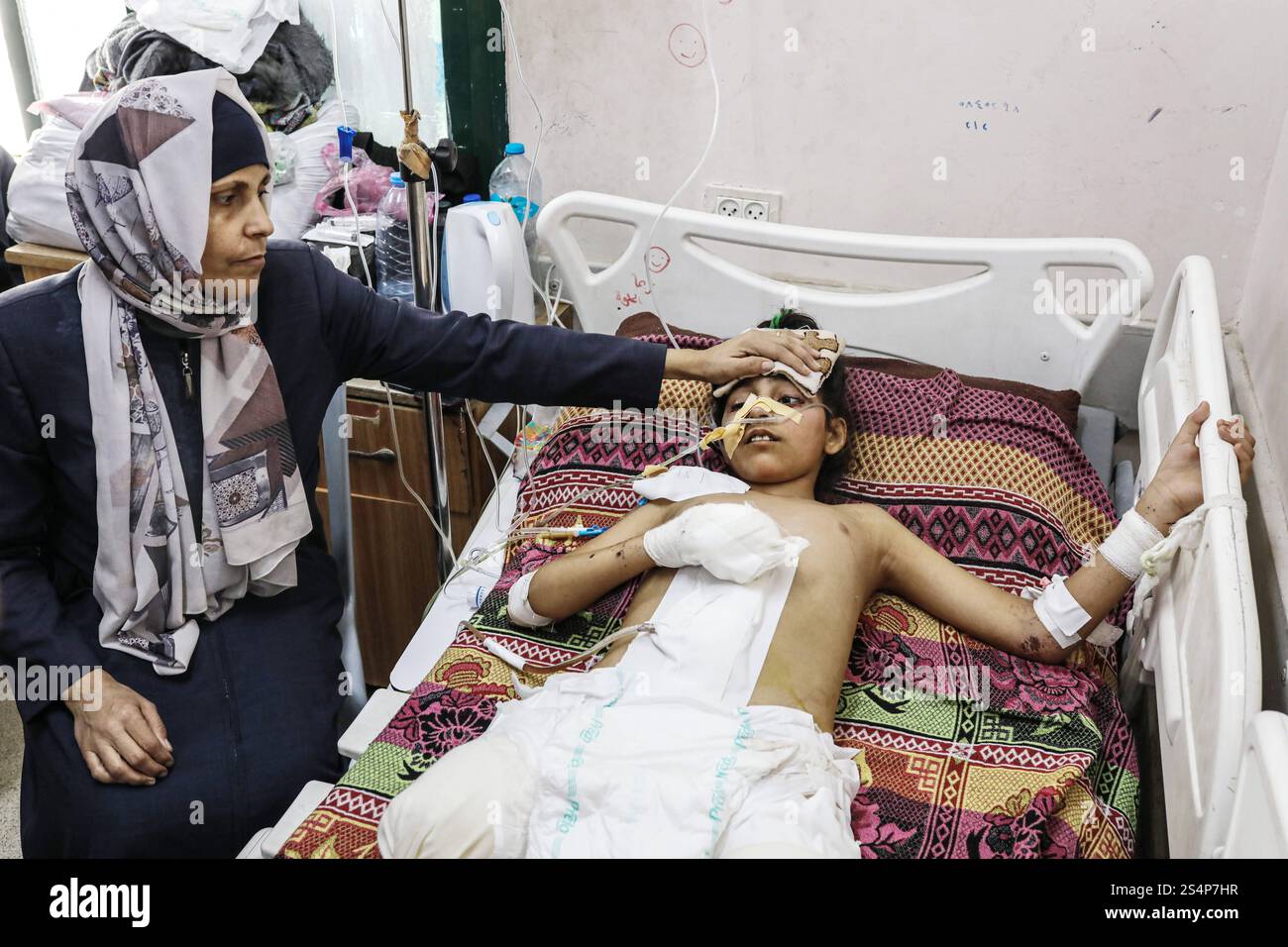Palestinian girl Saba Abu Abeda, 13, receives medical care at Al-Aqsa ...