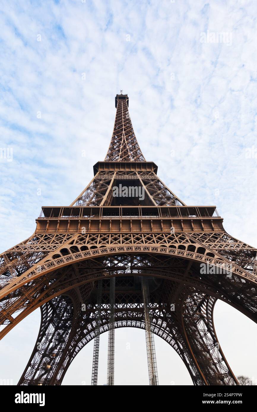 bottom view of Eiffel tower in Paris with white clouds on blue sky Stock Photo - Alamy