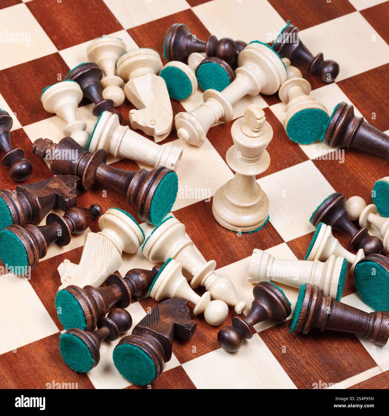 white king and scattered chess pieces on chessboard Stock Photo - Alamy