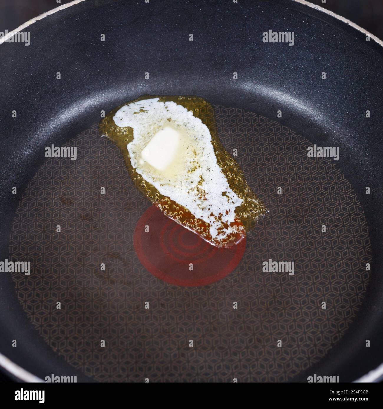 small piece dairy butter melting on hot frying pan close up Stock Photo ...