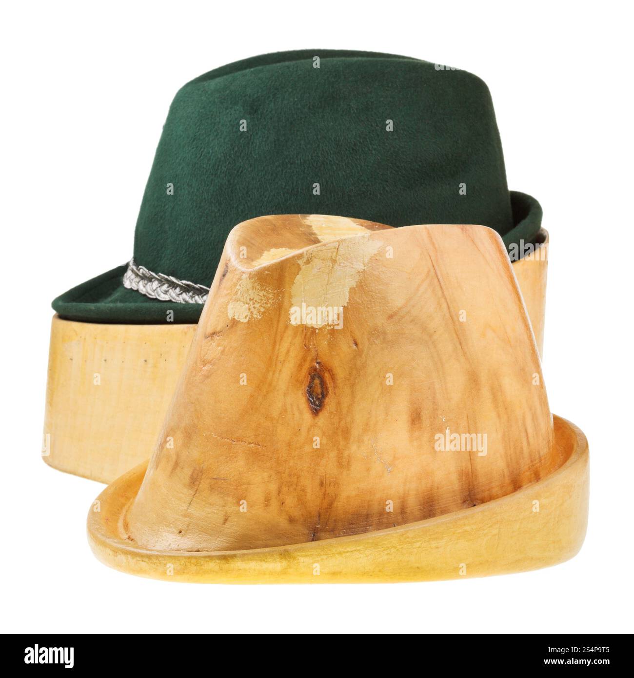 linden wooden hat block and green tyrolean felt hat isolated on white ...