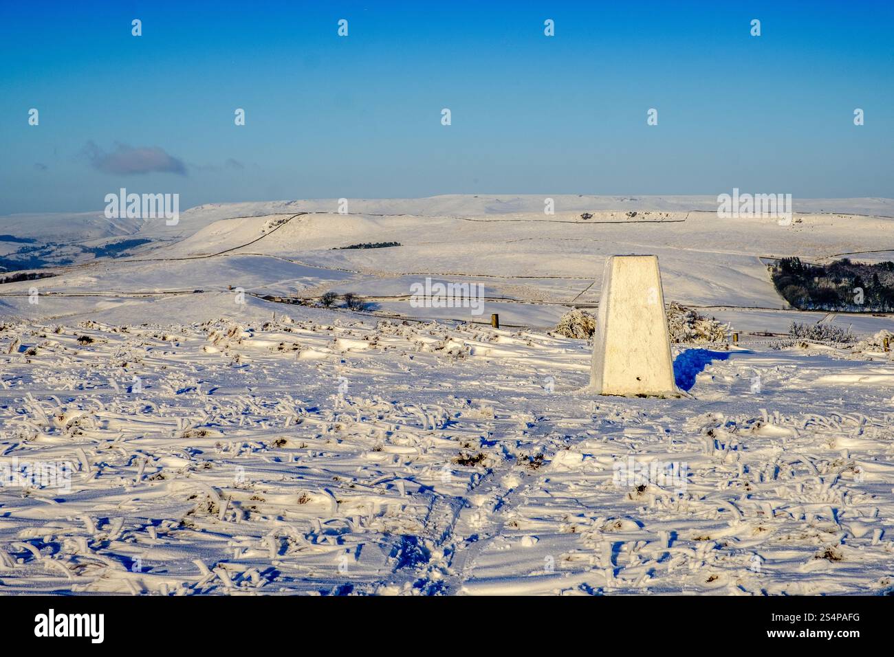 Trig point on Burbage Edge, Buxton in winter with Combs Moss and Kinder ...