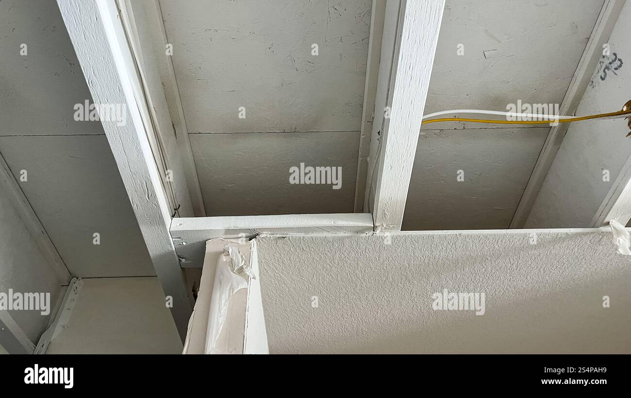 Exposed Ceiling Joists in Unfinished Basement Stock Photo - Alamy