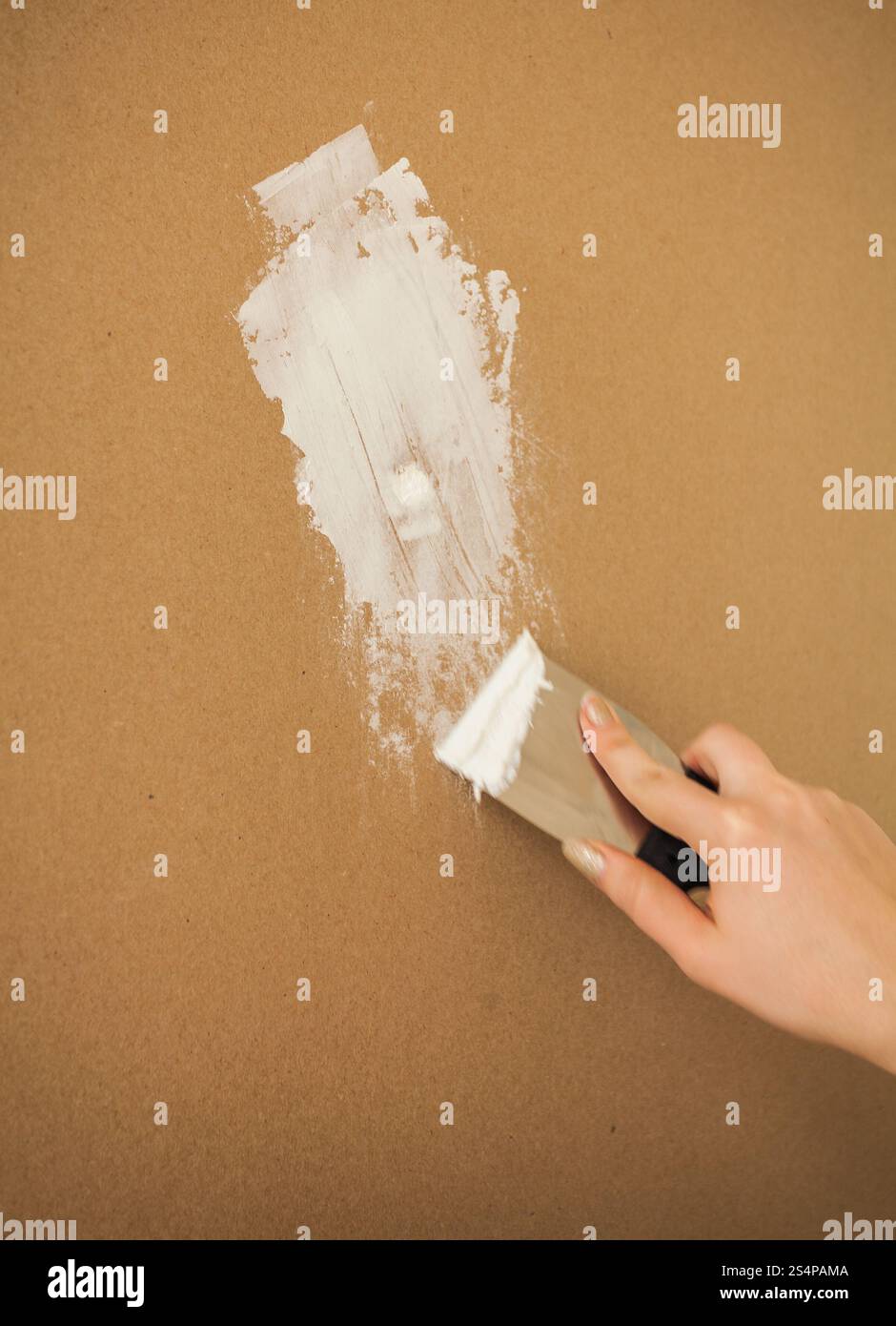 Photo of hand working with spatula and plaster Stock Photo - Alamy
