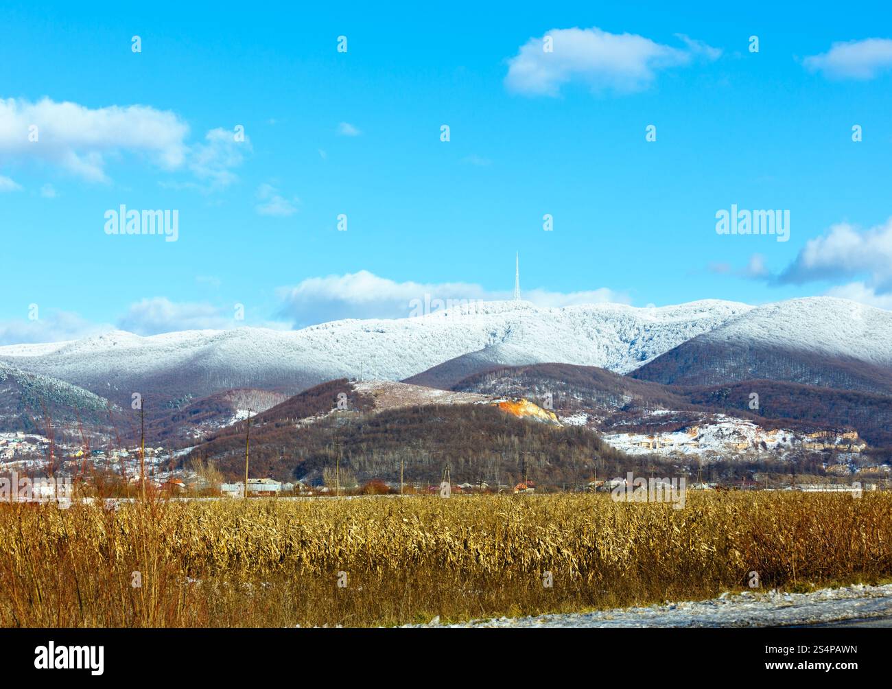 Country landscape with field and mountain with new-fallen snow ...