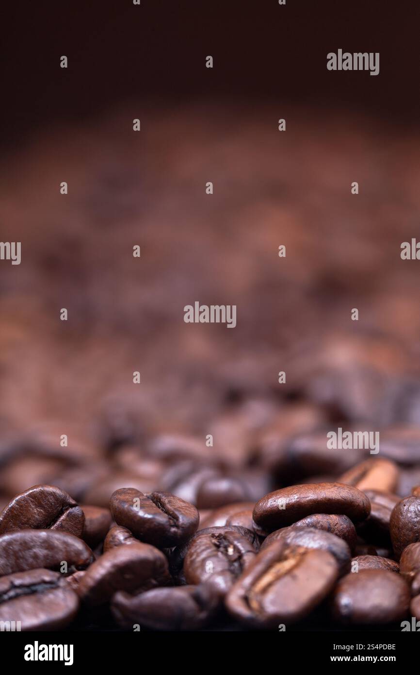strong roasted coffee beans black background with focus foreground ...