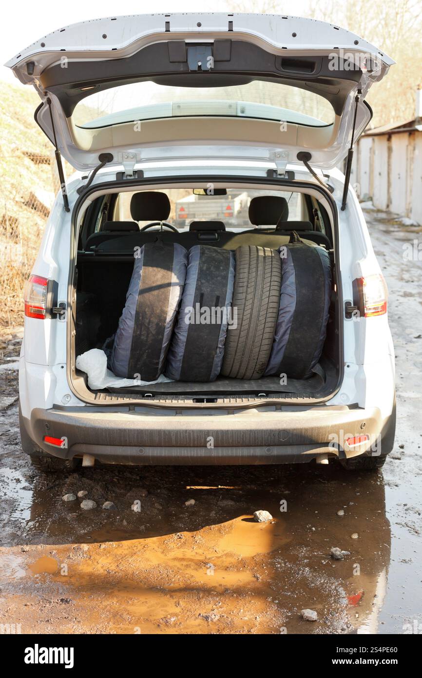 seasonal tire replacement - set of tires in boot of car Stock Photo - Alamy