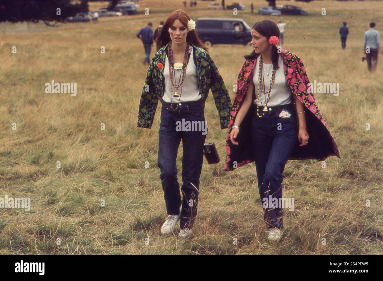 Young hippies walking on the grass, England 1970s Stock Photo - Alamy
