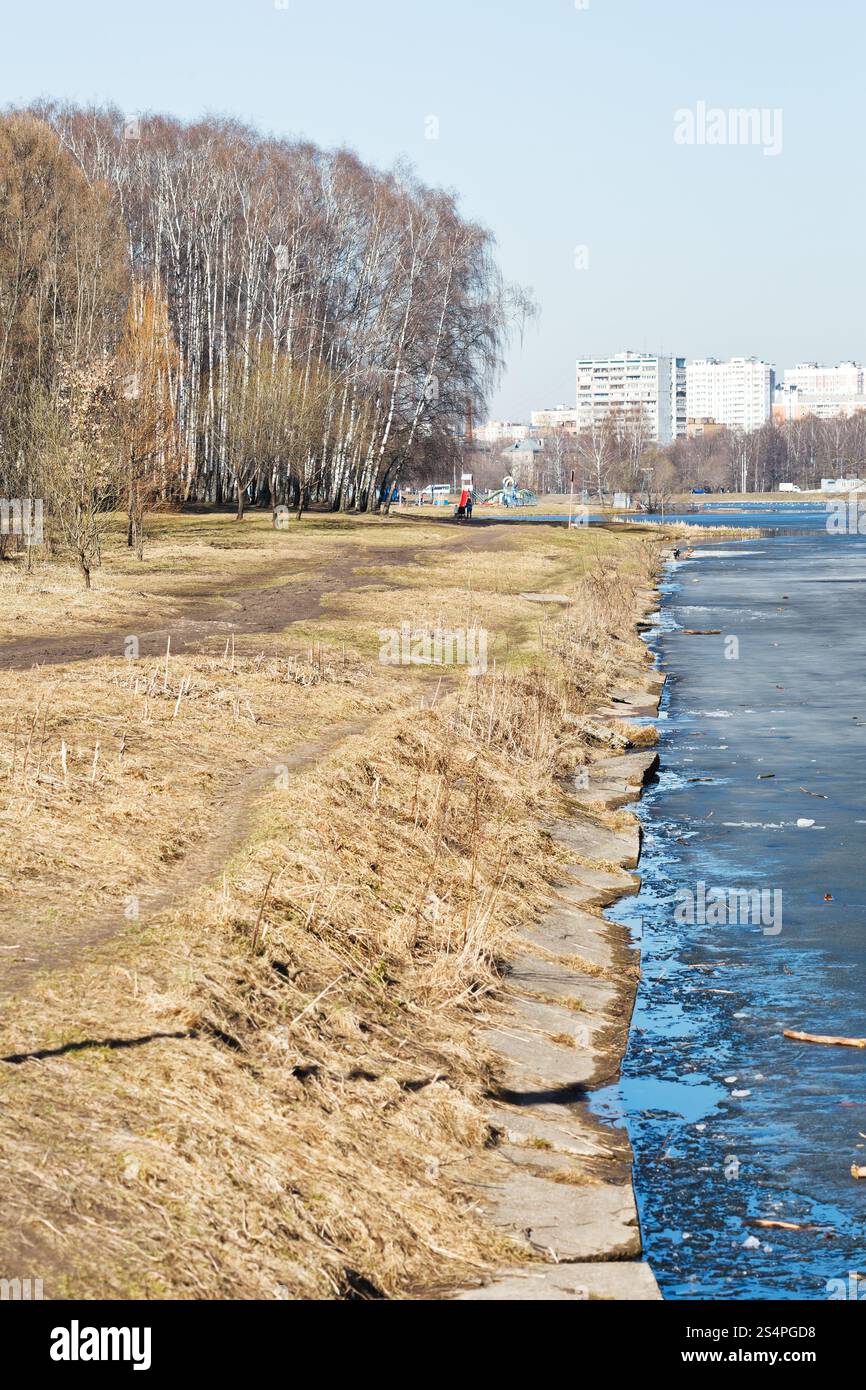 waterfront in urban park in early spring day Stock Photo - Alamy