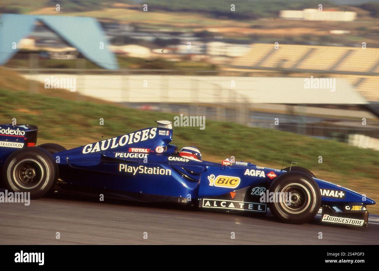 French F1 motorsports racing driver Olivier Panis on Prost Peugeot F1 ...