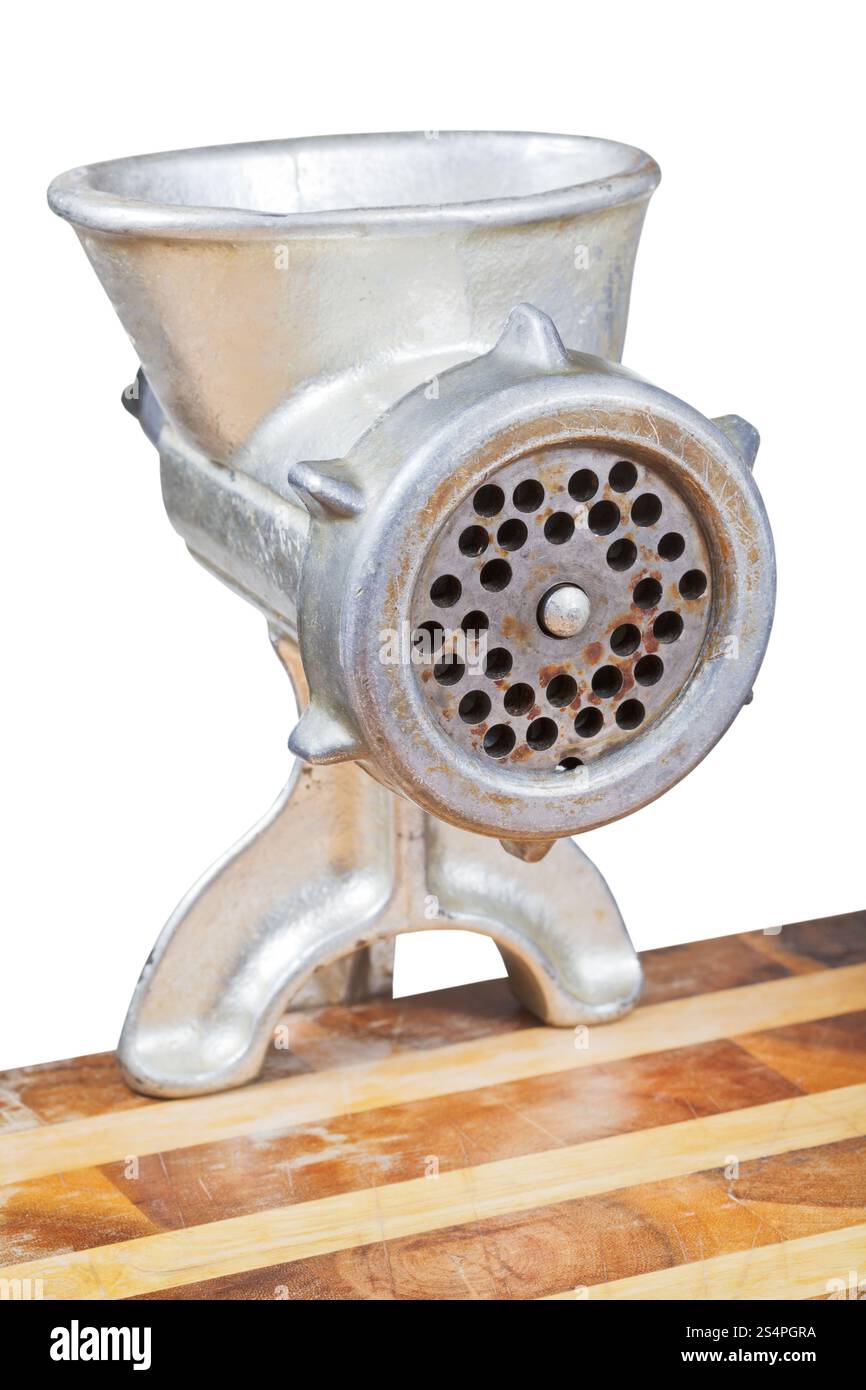 old iron meat grinder mounted on table isolated on white background ...