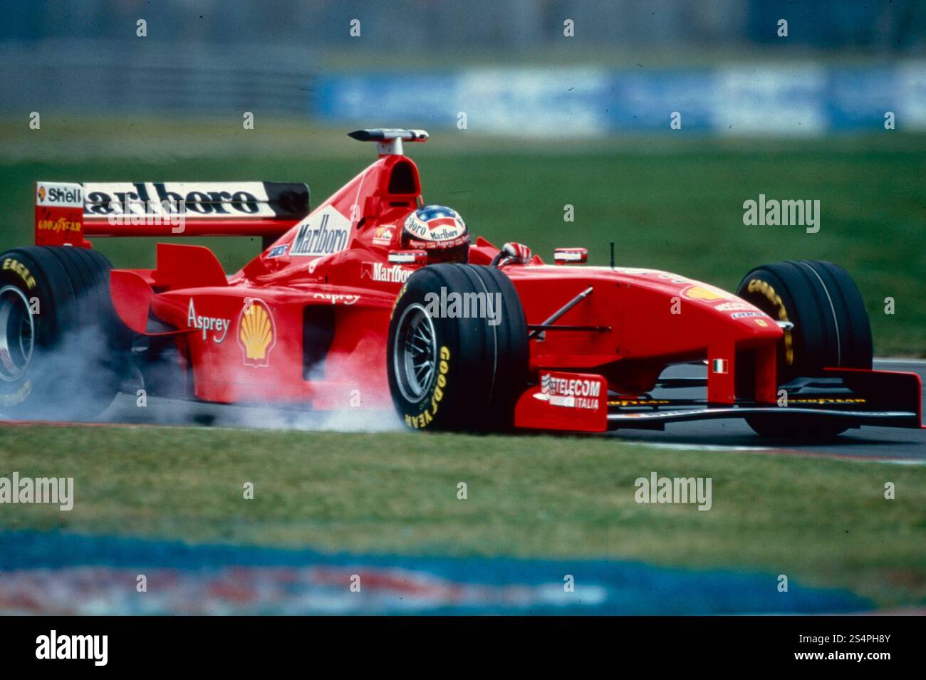 German motorsports racing driver Michael Schumacher on Ferrari F1 car ...