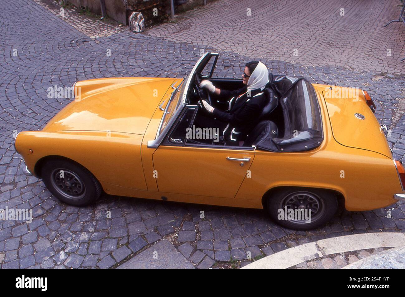 Woman driving a British MG Midget car, Italy 1999 Stock Photo - Alamy