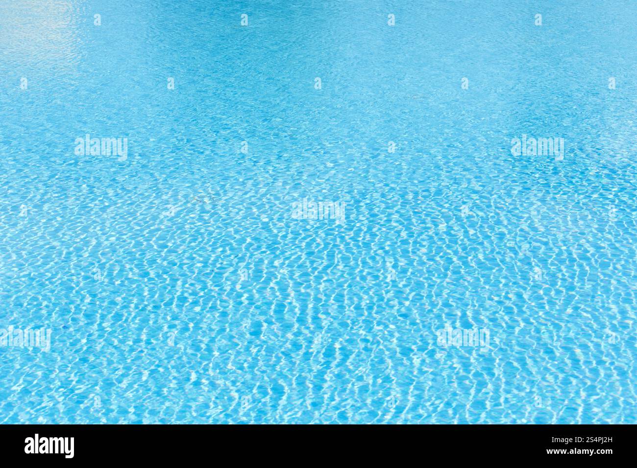 Patterns of sunlight rippling on a swimming pool water surface Stock ...