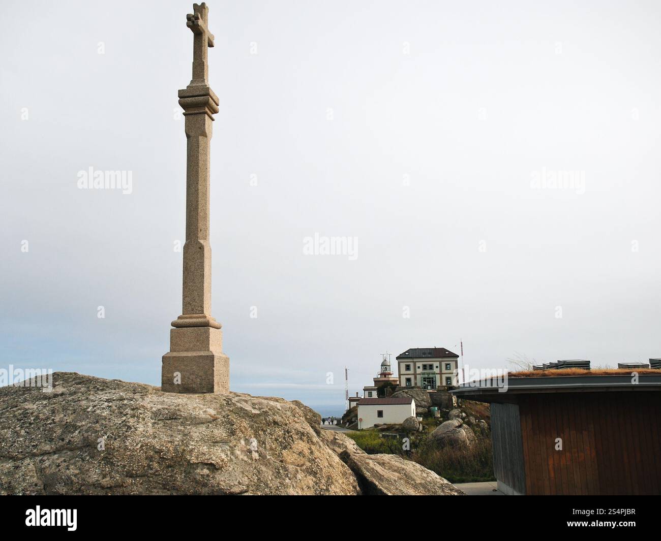 Christian cross and view of lighthouse on Cape Finisterre - the end of ...