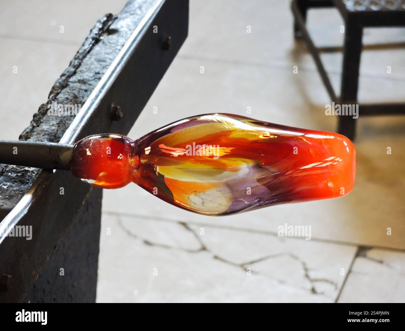 glassblowing of red bottle - glass production Stock Photo - Alamy